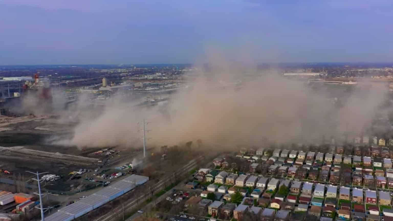 Drone Captures Dust Cloud Covers Little Village After Smokestack Demolition
